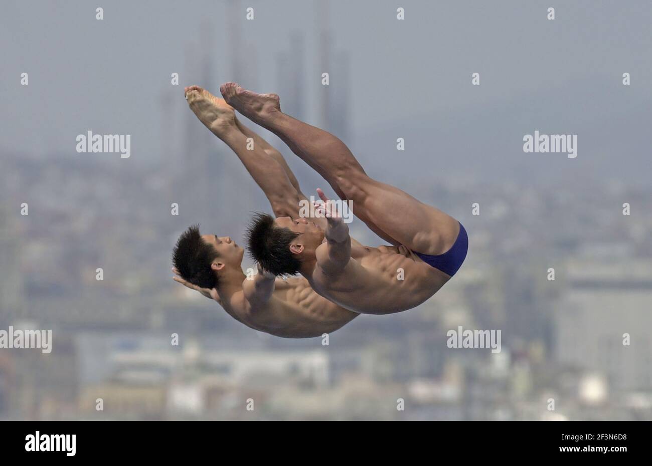 Chinese divers liang Thian and Jia Hu during the synchronized diving ...
