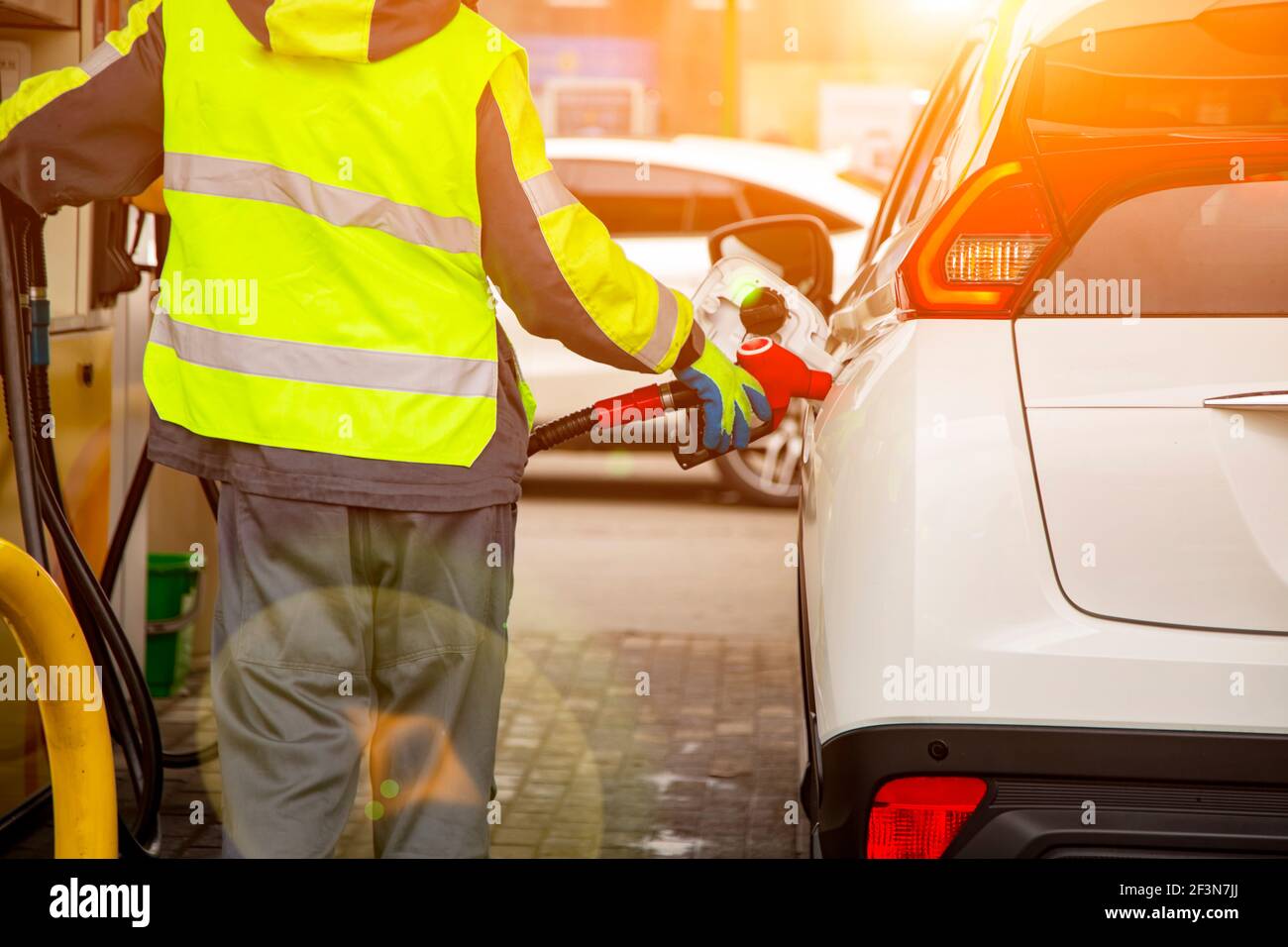Gas station attendant filling up hi-res stock photography and images ...