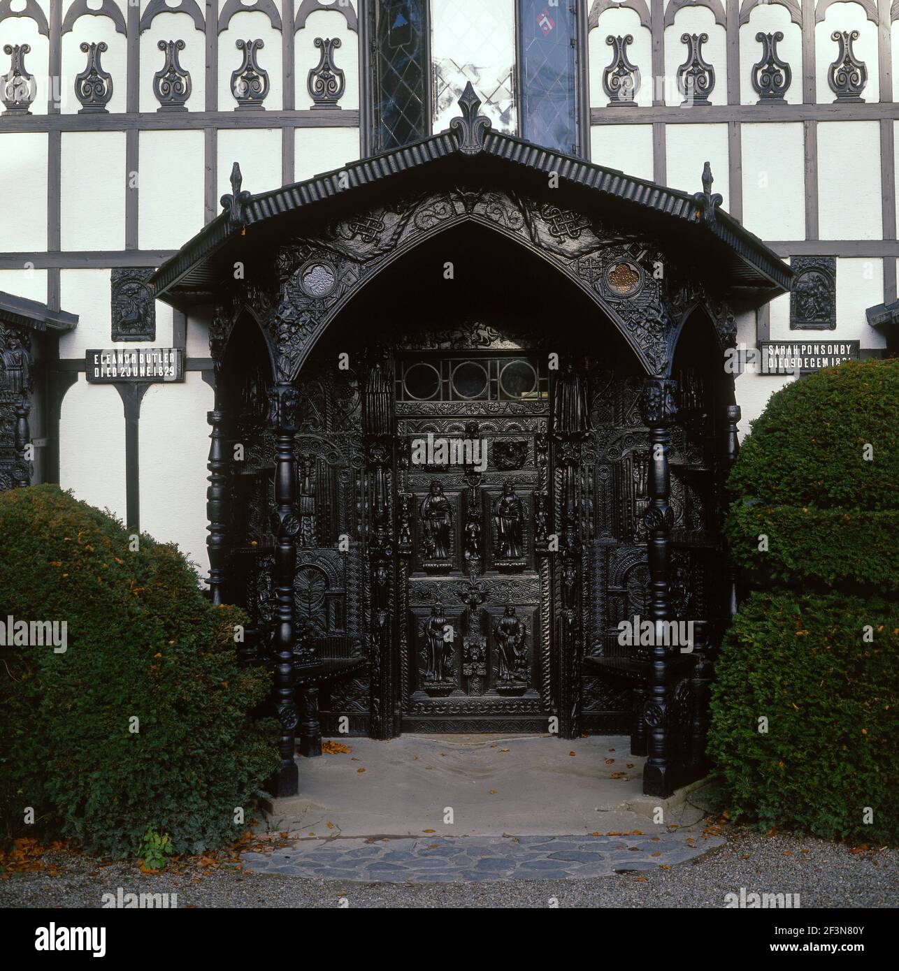 Ornately carved door on building at Plas Newydd. (National Trust Stock ...