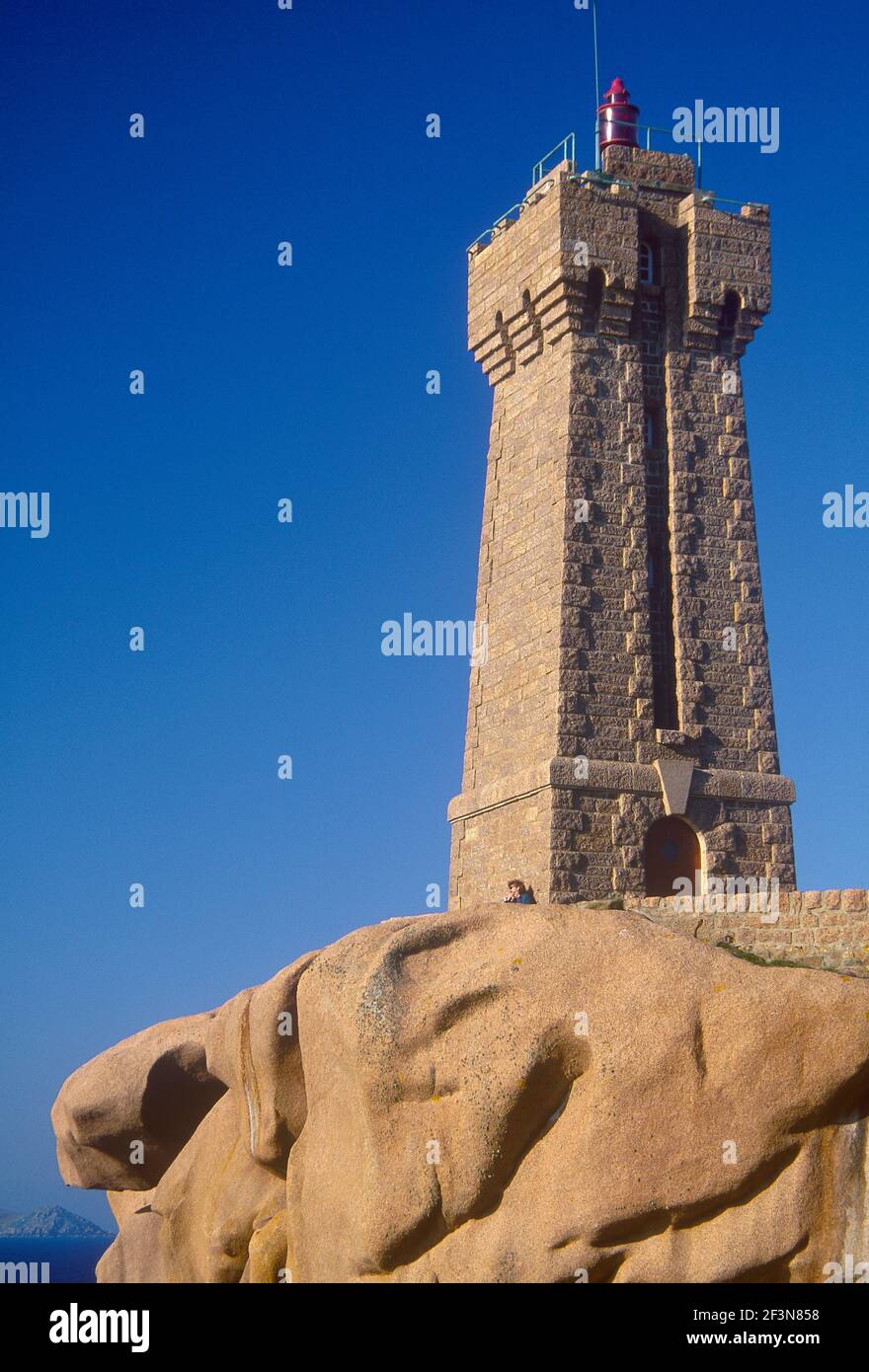 Cote de Granit Rose. Lighthouse. Pink granite tower. Carved. Smooth ...
