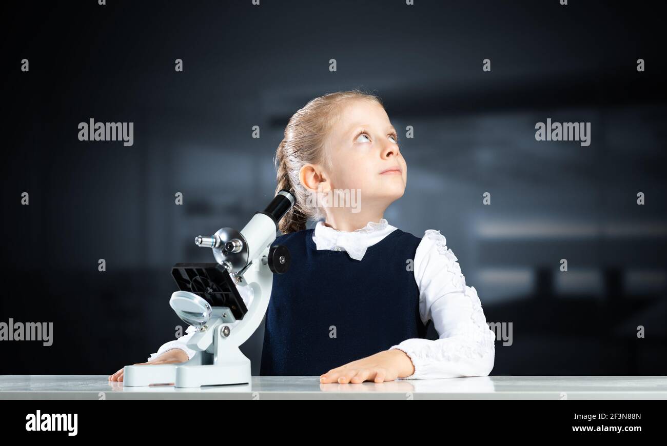 Little girl scientist with microscope Stock Photo - Alamy