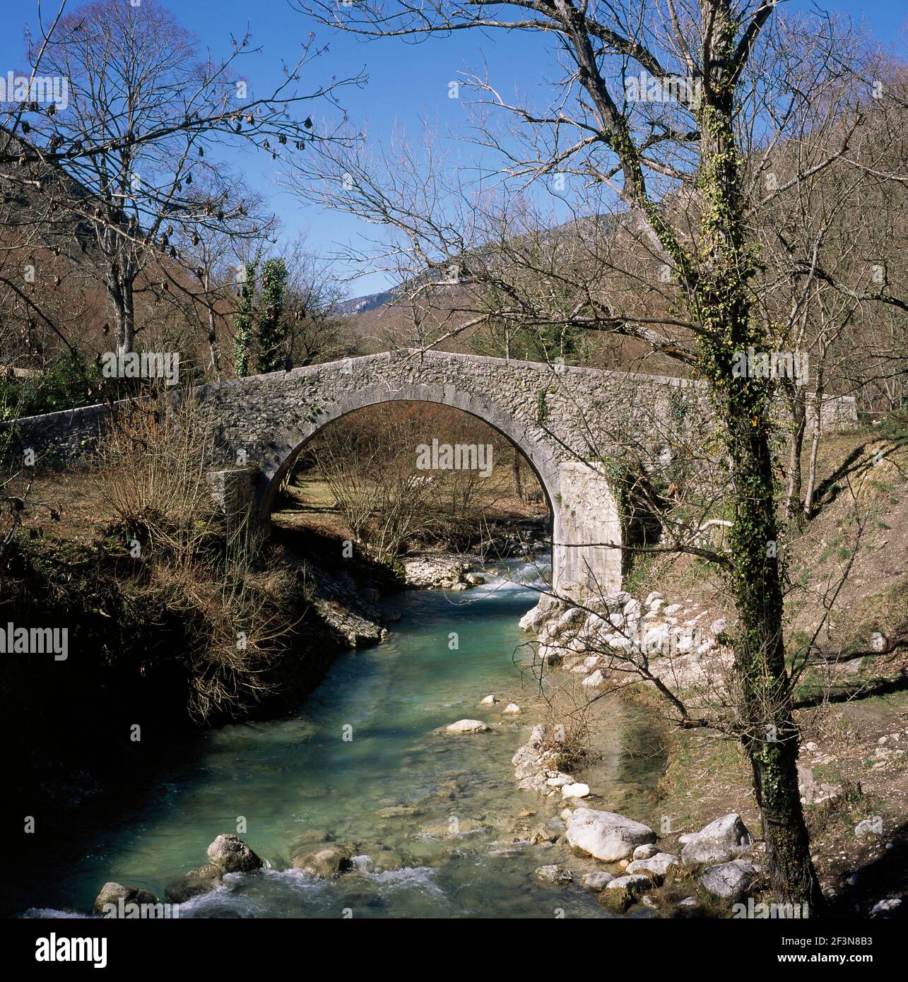 Water flowing over the top of the bridge crossing at hi-res stock ...