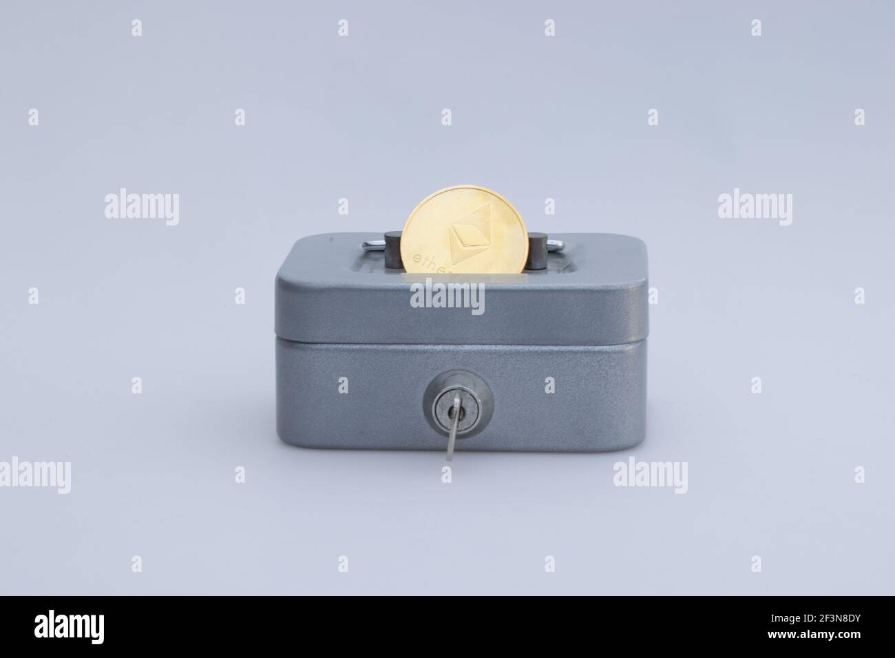 Little saving vault with golden Ethereum, ETH coin virtual money ...