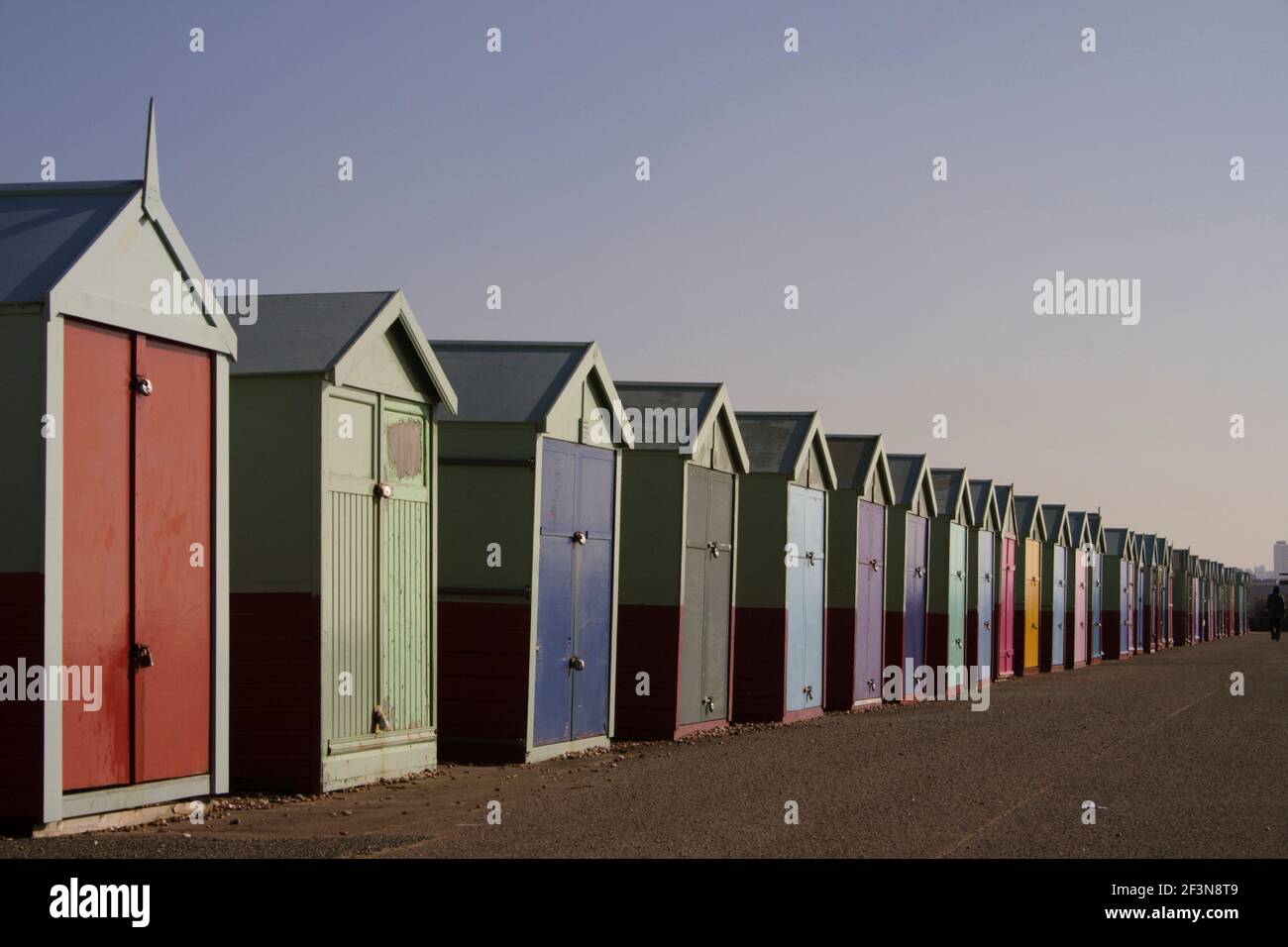 Row of beach huts on the beach. Beachhuts. Wooden buildings. Colourful ...