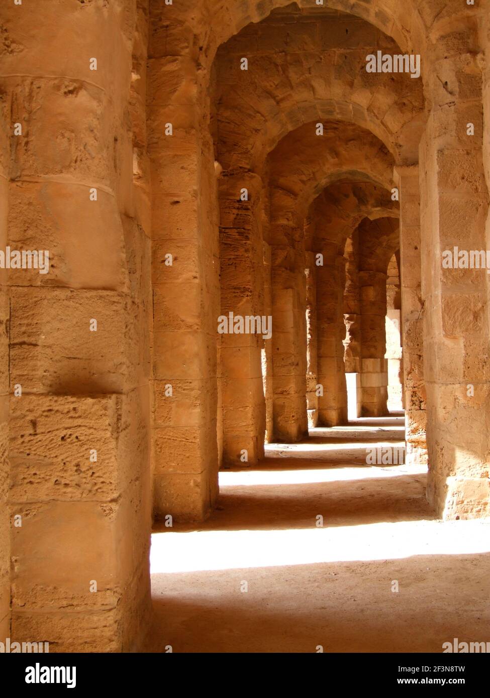 El Jem. Roman amphitheatre. Building. Arena. Colonnade. Alleyway with ...