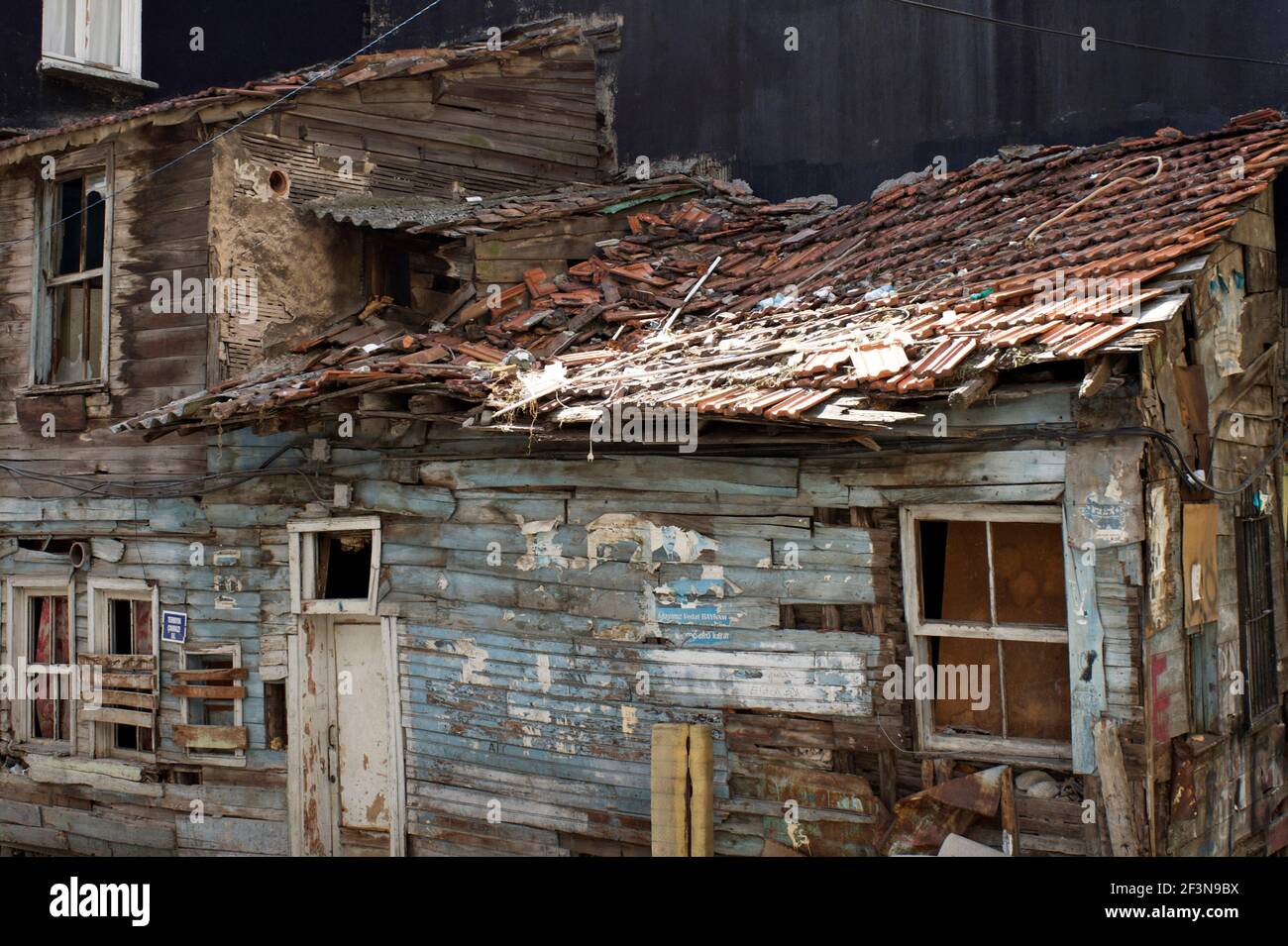 There are houses in very poor repair with no windows, and damaged roofs ...