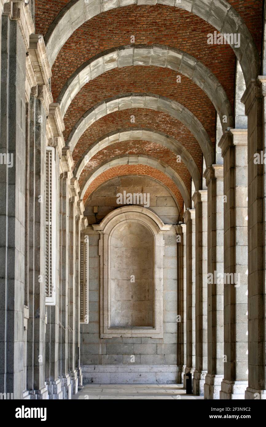 Red brick and stone arches of the passageway leading to the Real ...