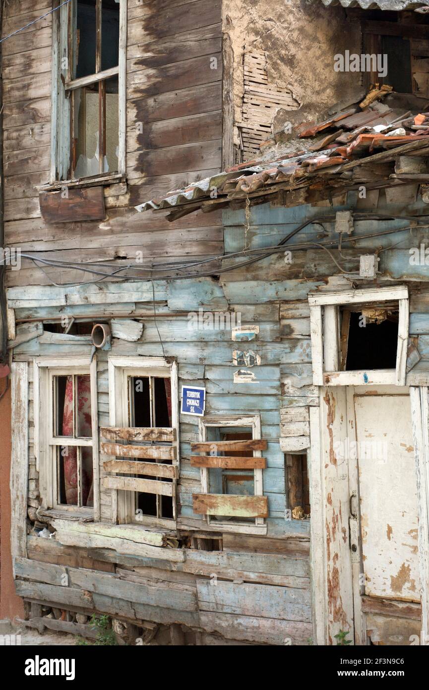 There are houses in very poor repair with no windows, and damaged roofs ...