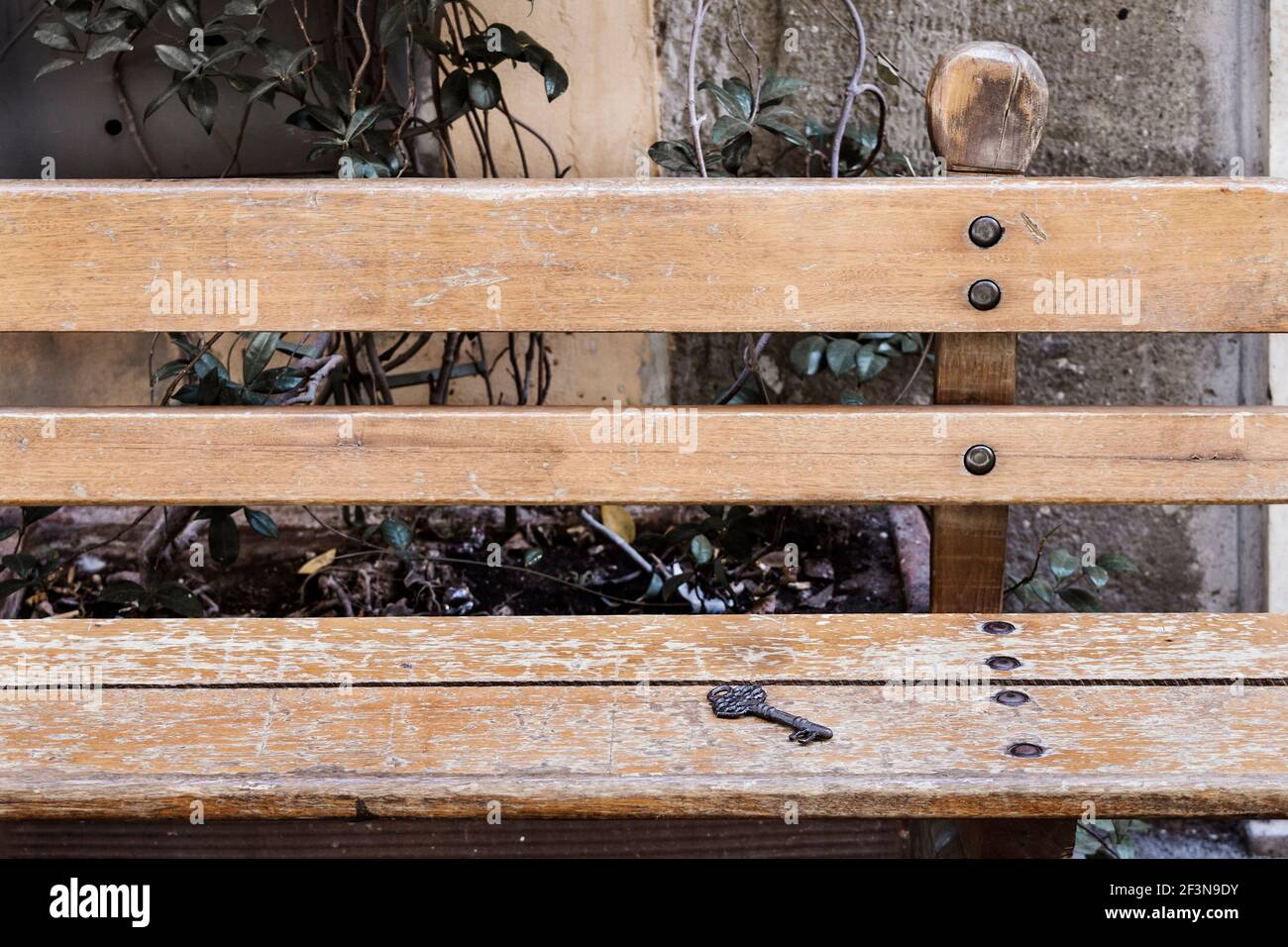 Historical key on a wood bench Stock Photo - Alamy