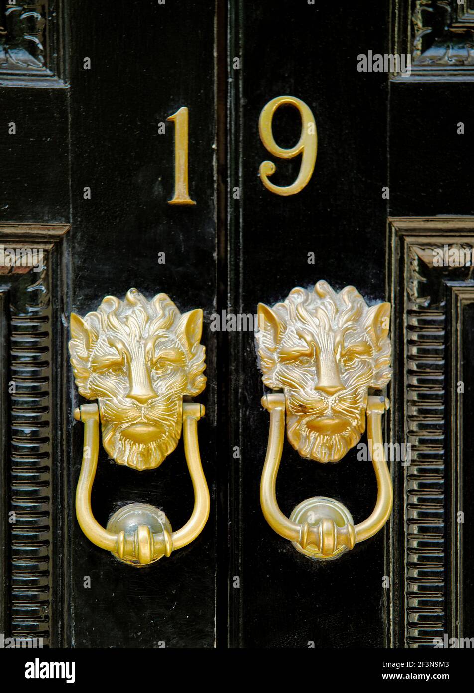 Traditional front doors in London have large numerals indicating the ...