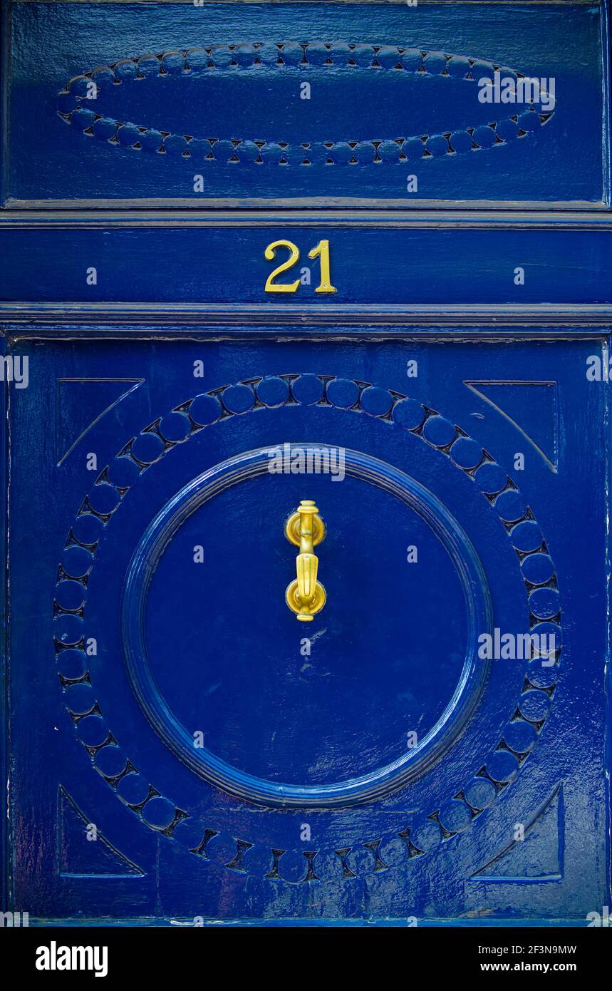 Traditional front doors in London have large numerals indicating the ...