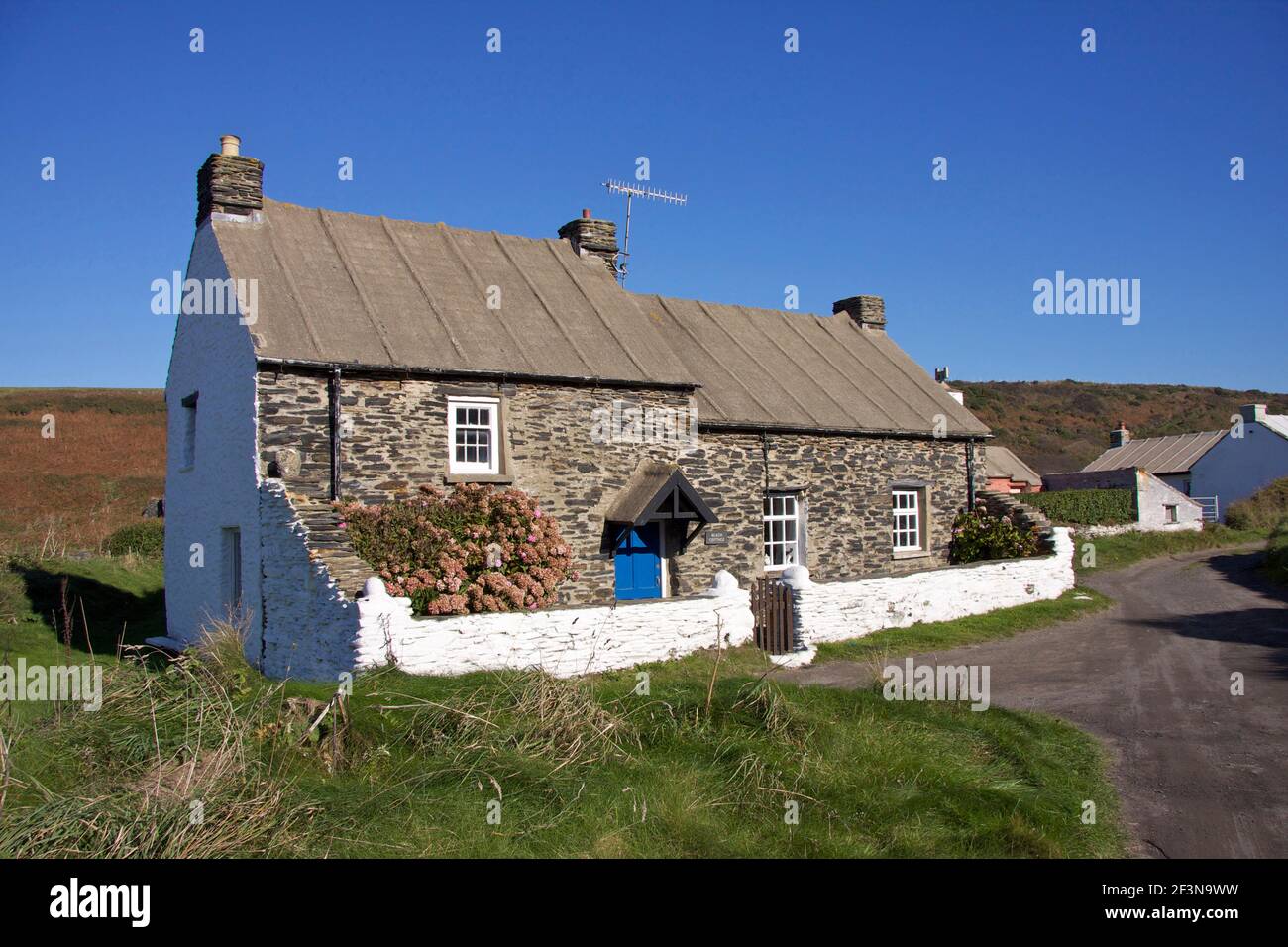 There are historic cliff top cottages on the headland above Abereiddy ...