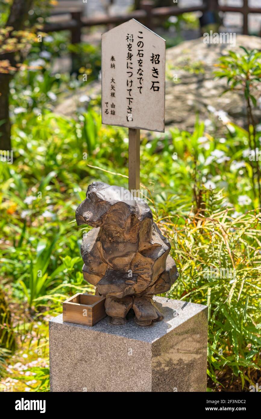 tokyo, japan - march 15 2021: Stone monument Maneki-ishi depicting the ...
