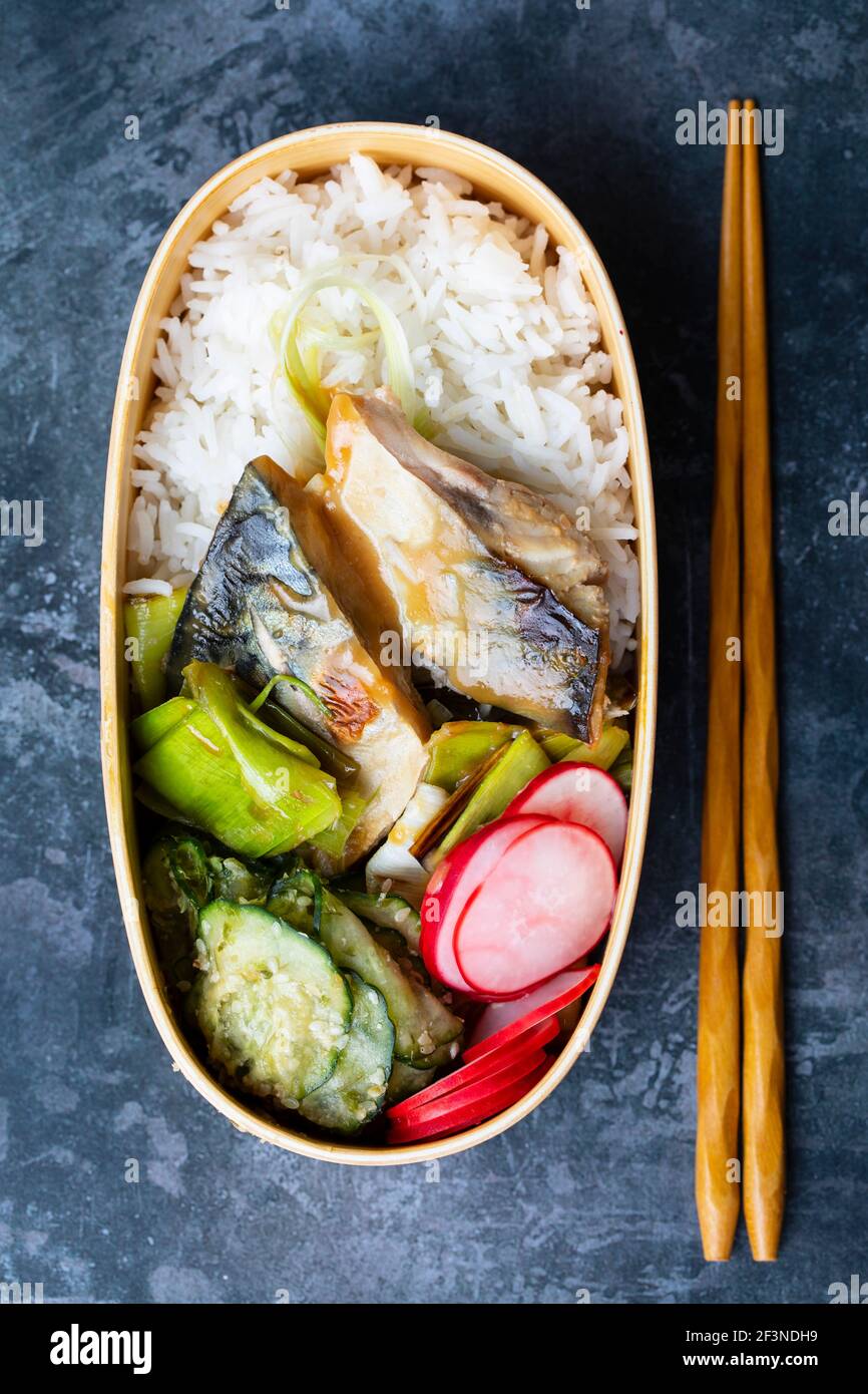 Japanese bento box with miso mackerel, cucumber salads and pickled ...