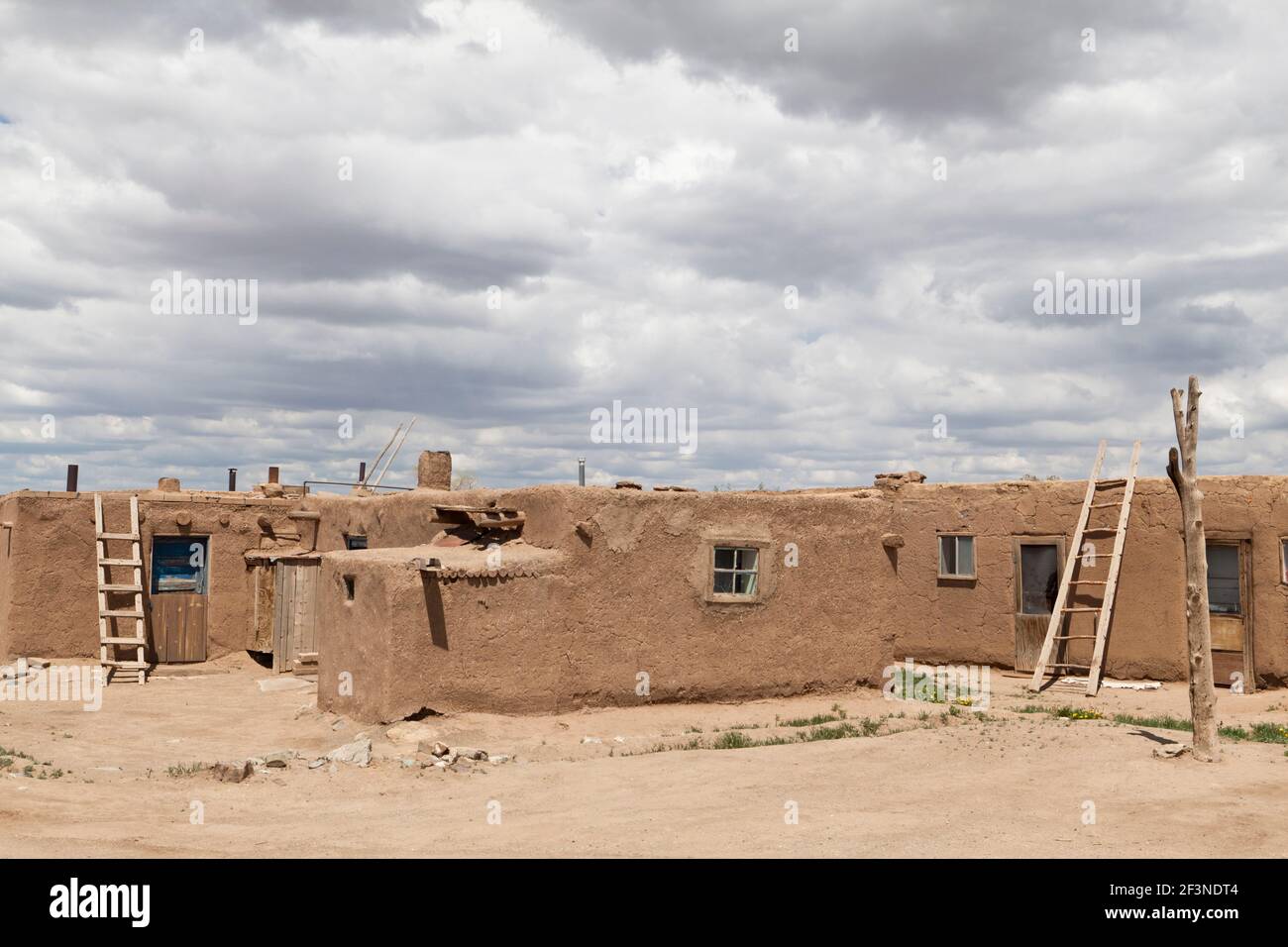Ancient adobe houses in the historic Native American settlement of Taos ...