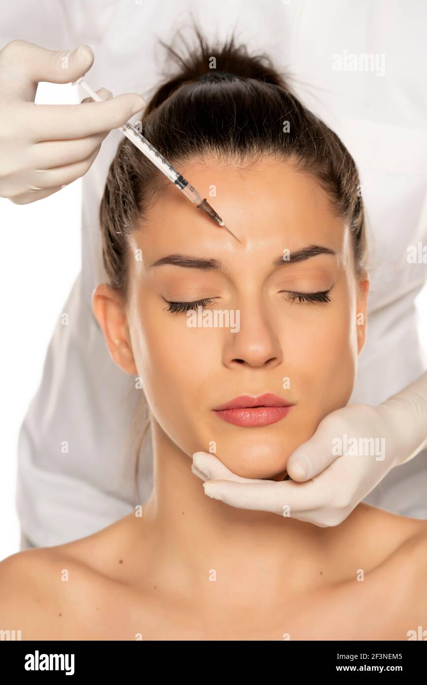 Portrait of a young beautiful woman on a face filler injection ...