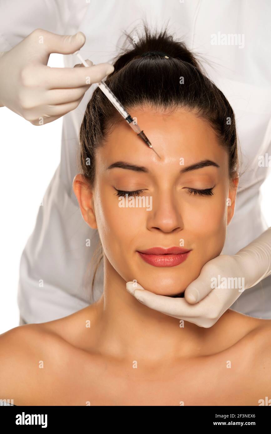 Portrait of a young beautiful woman on a face filler injection ...