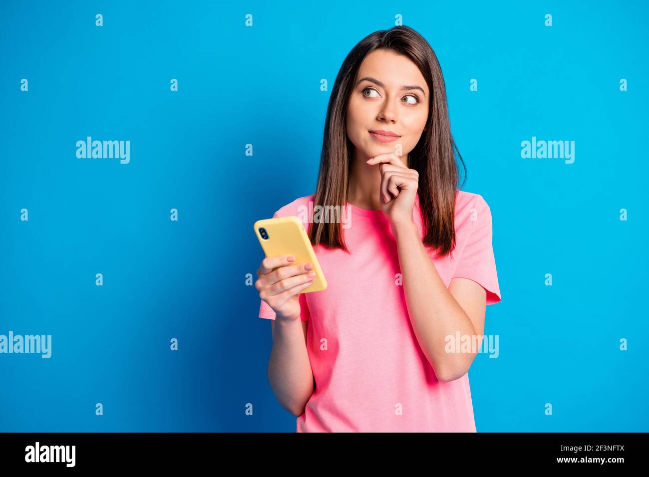 Portrait of pretty clever person arm on chin look empty space stylish ...