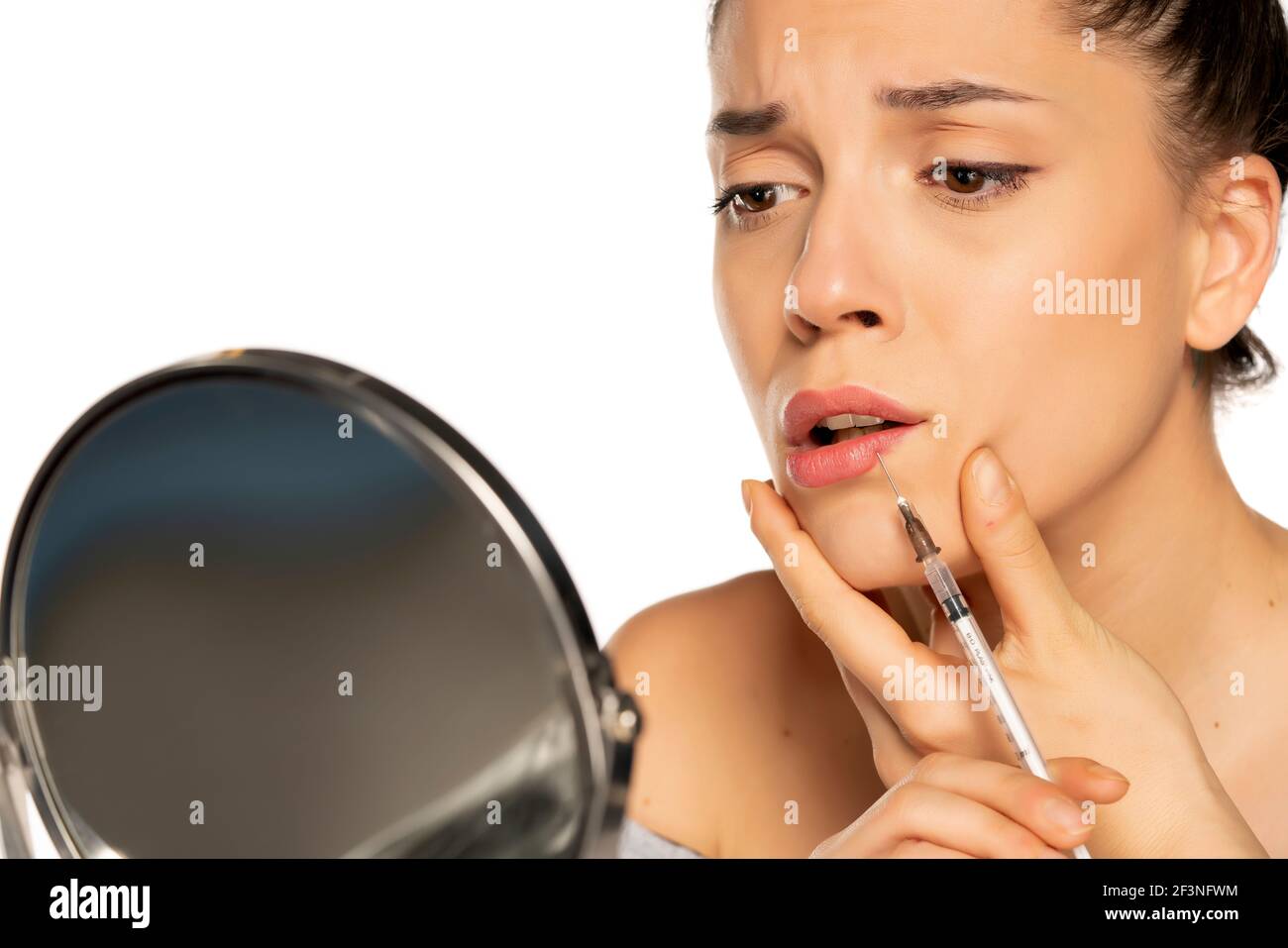 Portrait of a young beautiful woman on a face filler self injection ...