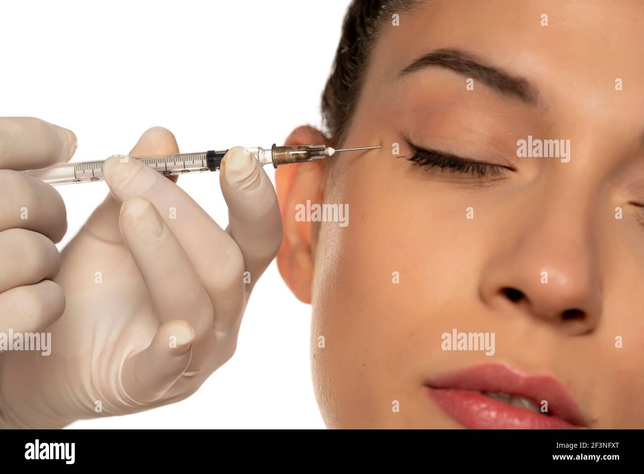 Portrait of a young beautiful woman on a face filler injection ...