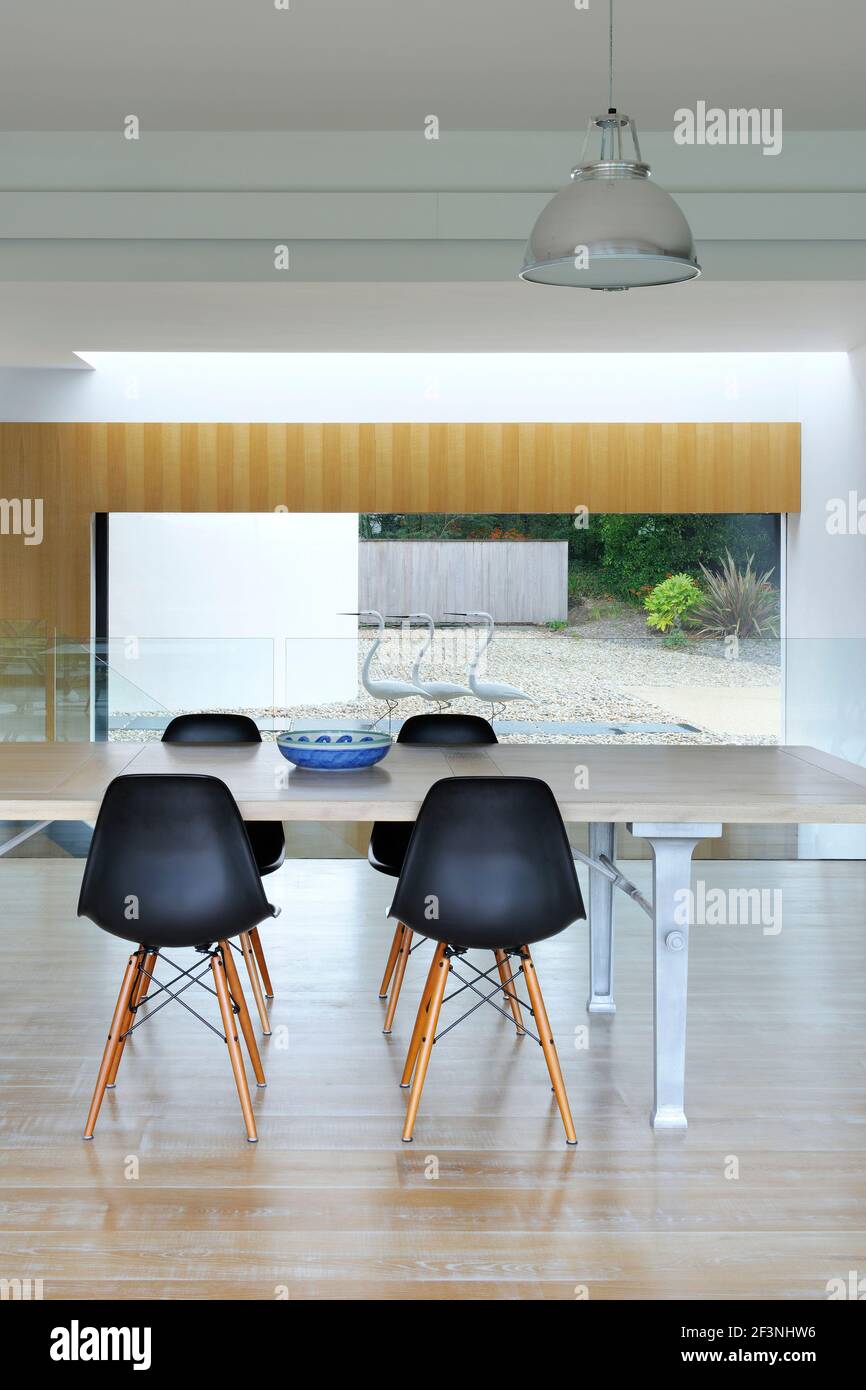 The main living space, looking across the dining table to the ground ...