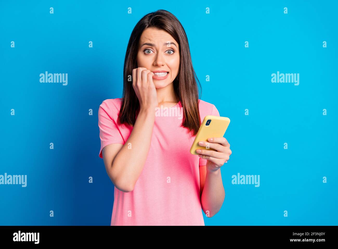 Photo portrait of female influencer biting fingers nervous keeping ...