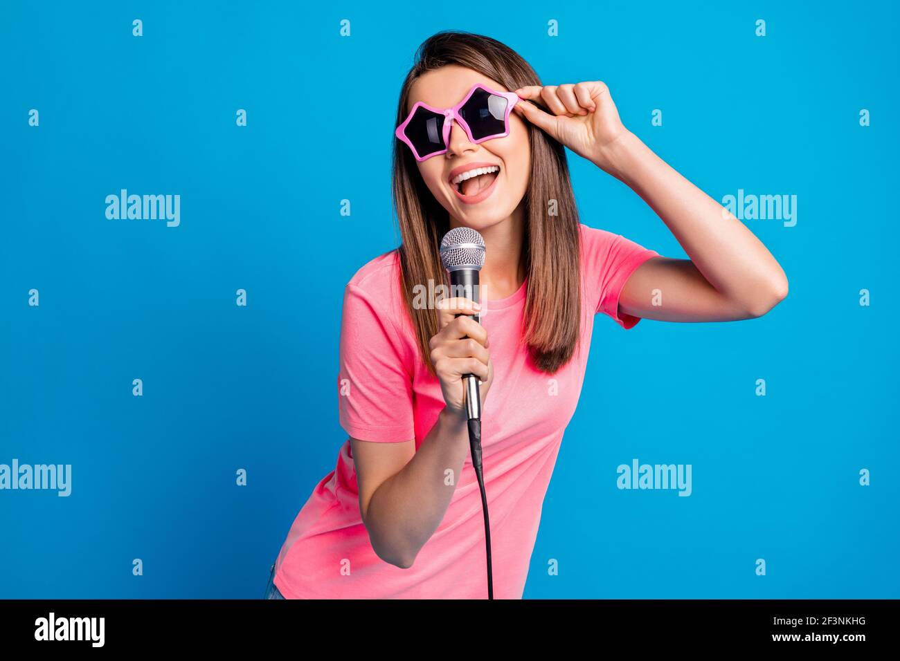 Photo portrait of young funky girl singing microphone on concert ...