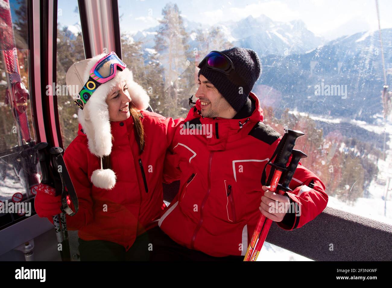 Happy friends on chair lift hi-res stock photography and images - Alamy