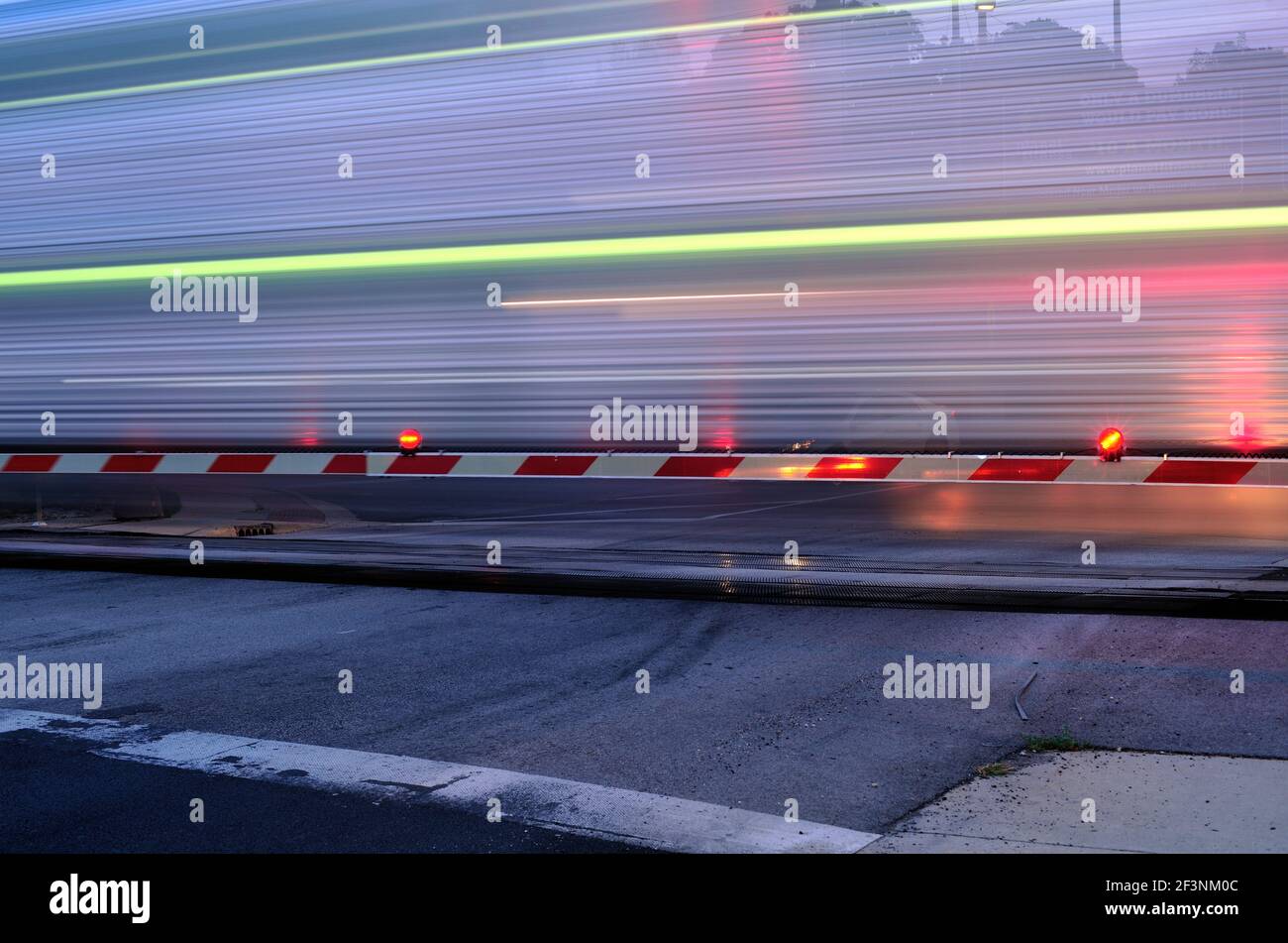 Elgin, Illinois, USA. A moving Metra commuter train takes on a ghostly ...
