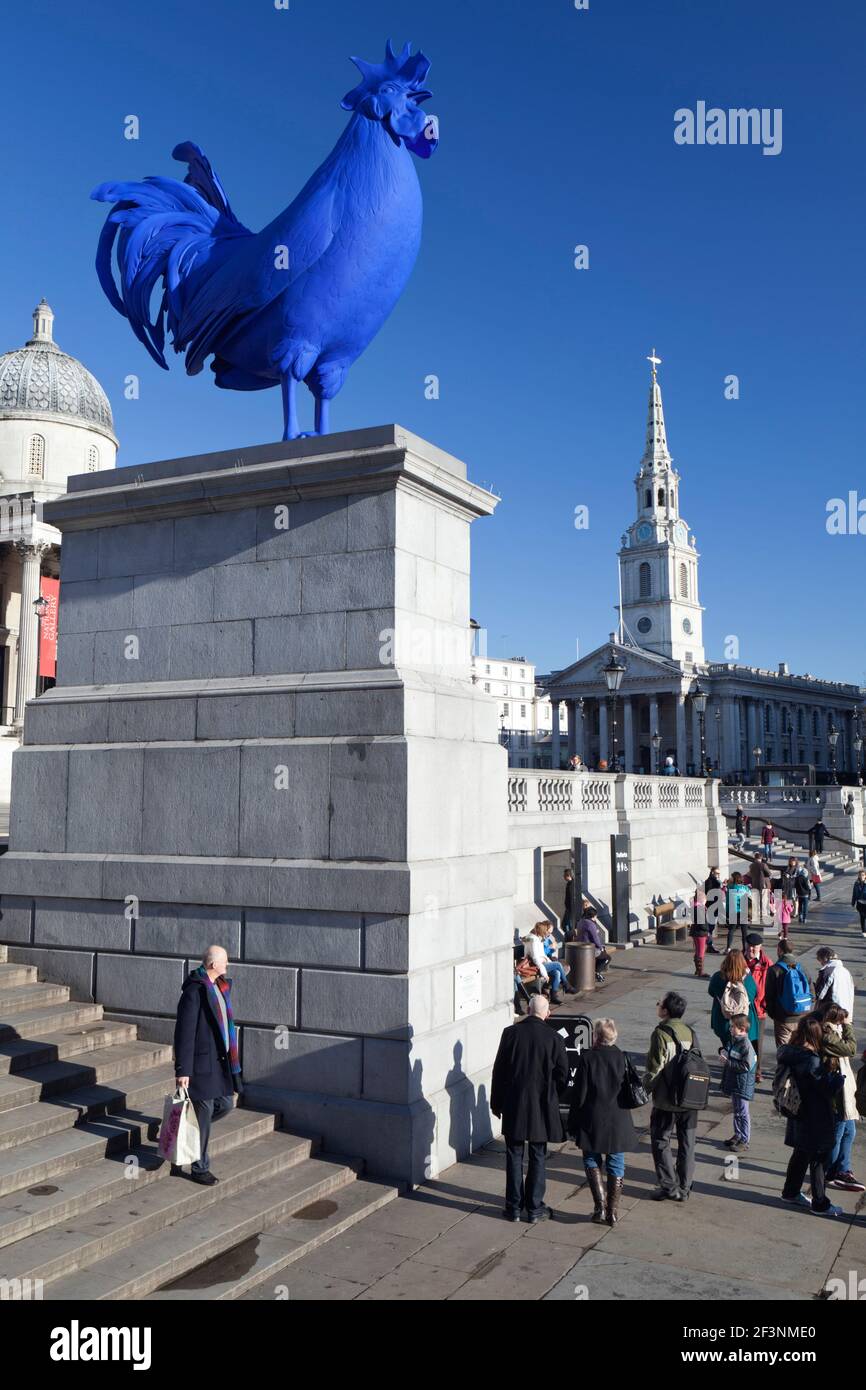 Tourists view the Blue Cockerel sculpture on the Fourth Plinth ...