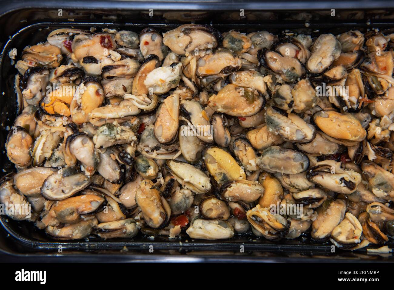 Plastic container delicious mussels hi-res stock photography and images ...
