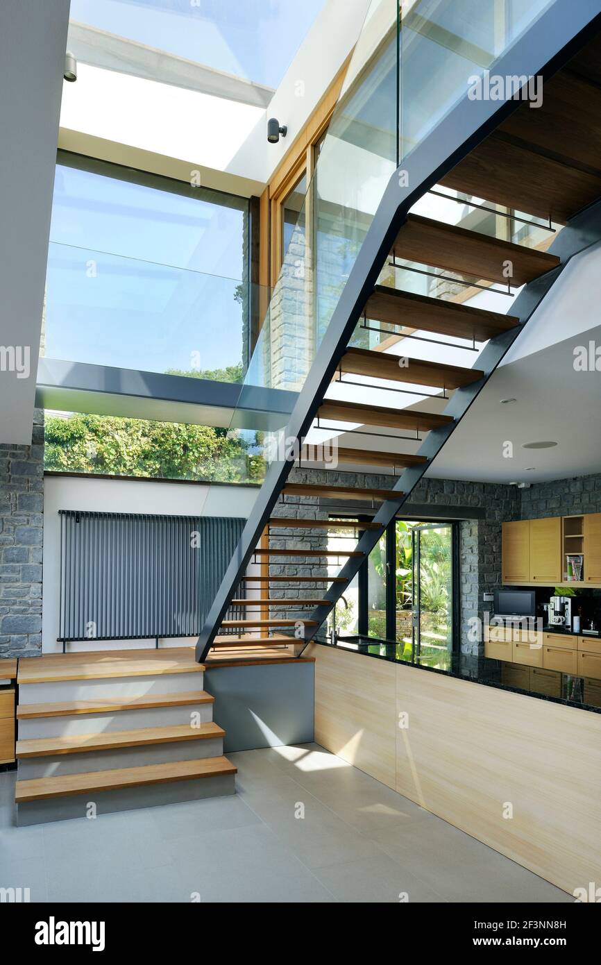 The interior spaces of a modern house on the cliffs overlooking the sea ...