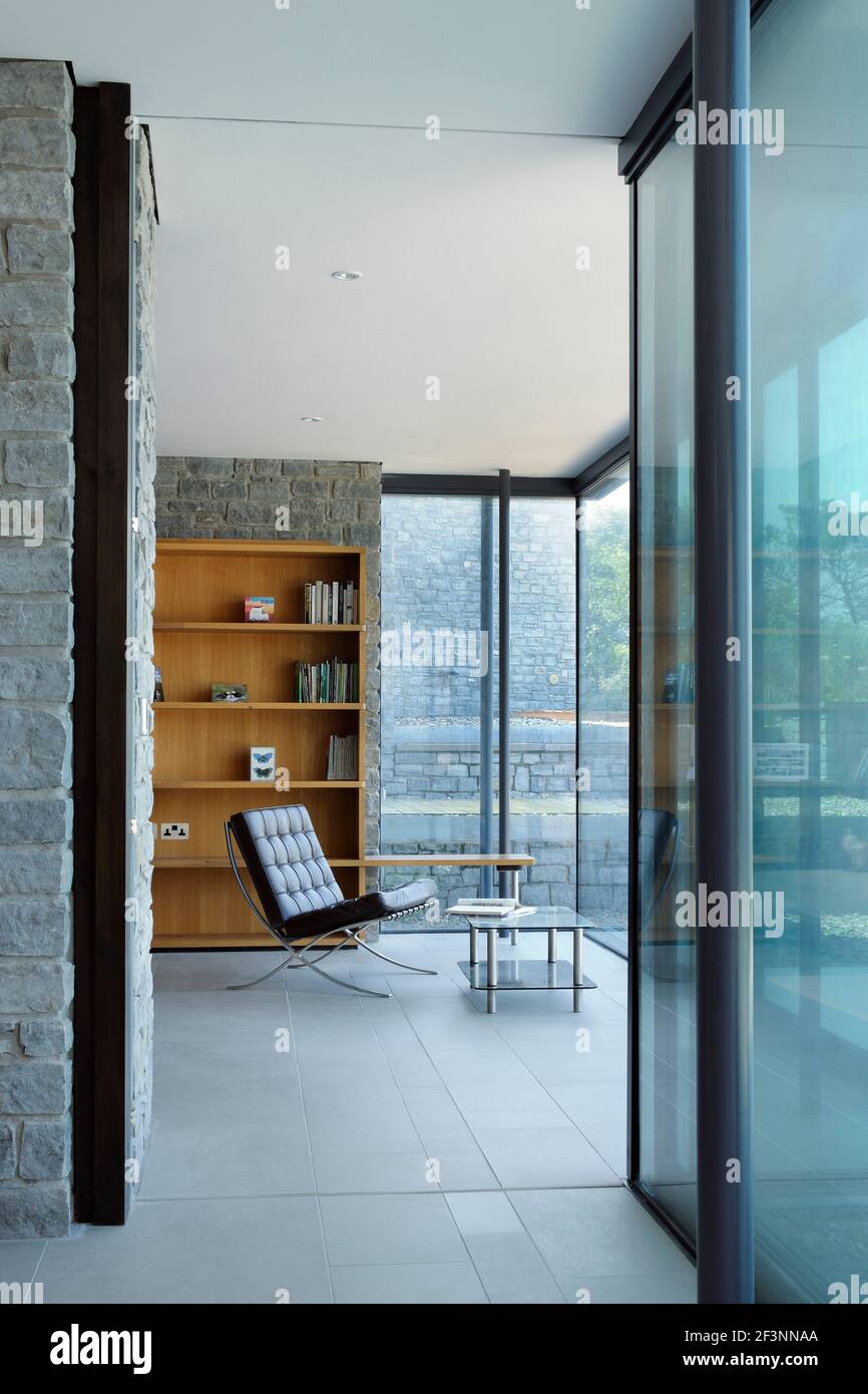 The interior spaces of a modern house on the cliffs overlooking the sea ...