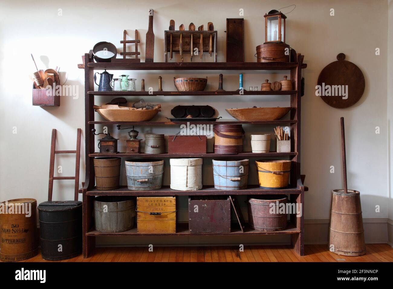 Items displayed on open shelves in hallway or pantry Stock Photo - Alamy