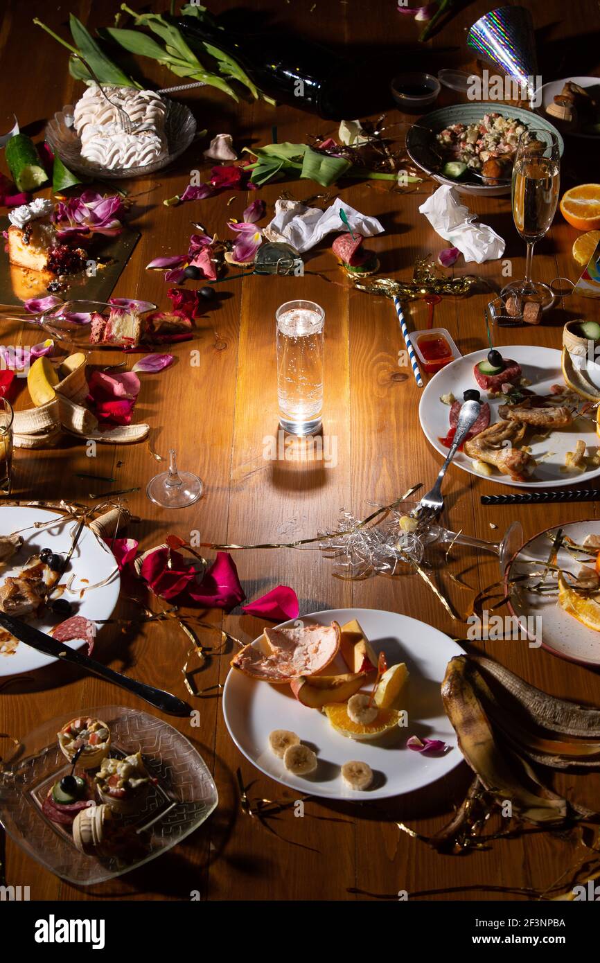 Early morning after the party. Glass of pure, cold water on the table ...