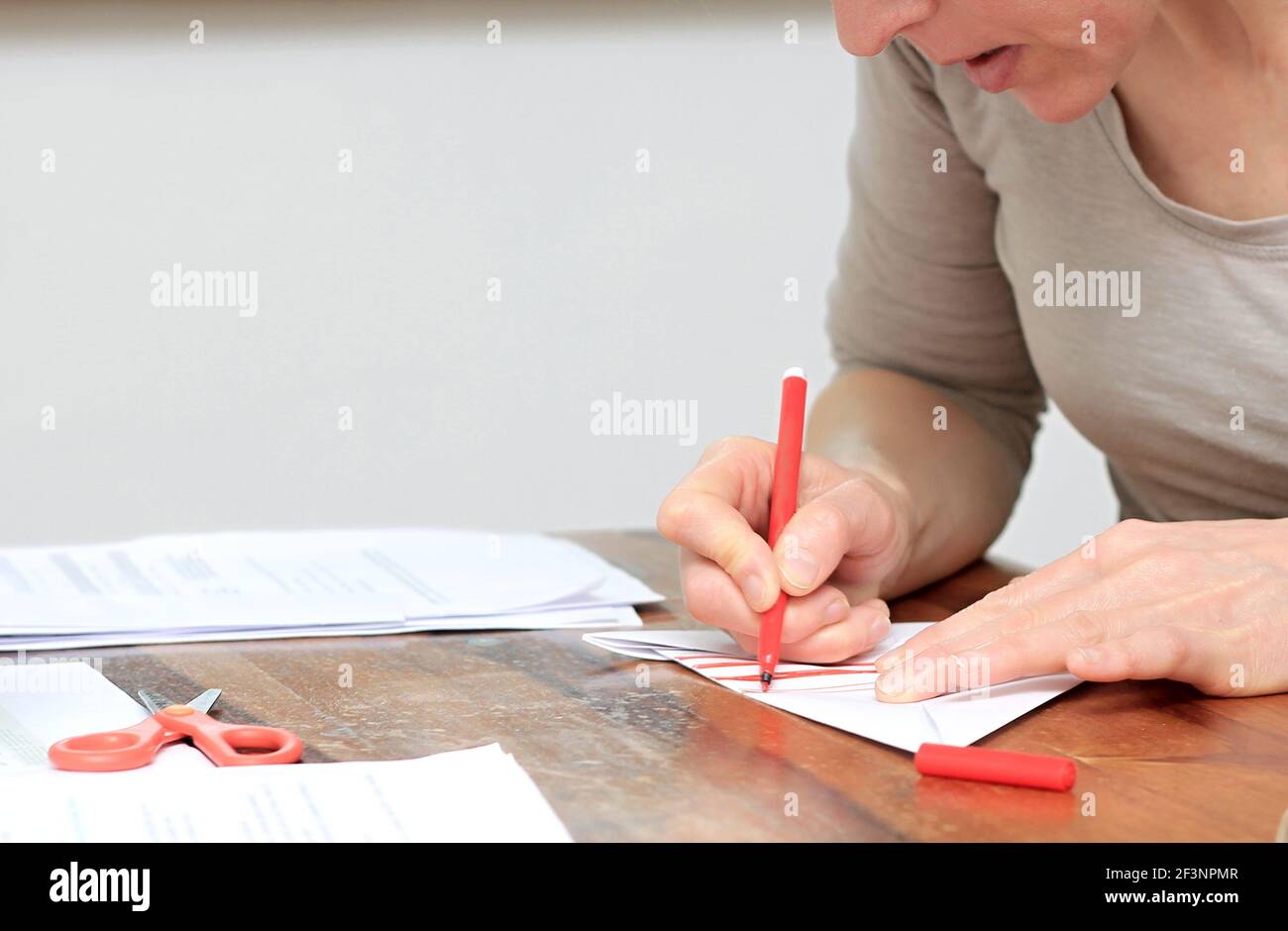 homework at home with child doing office work on the table with pen and ...