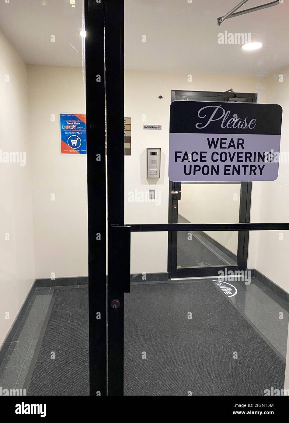 Entrance door with Please wear face mask sign, Queens, New York Stock ...