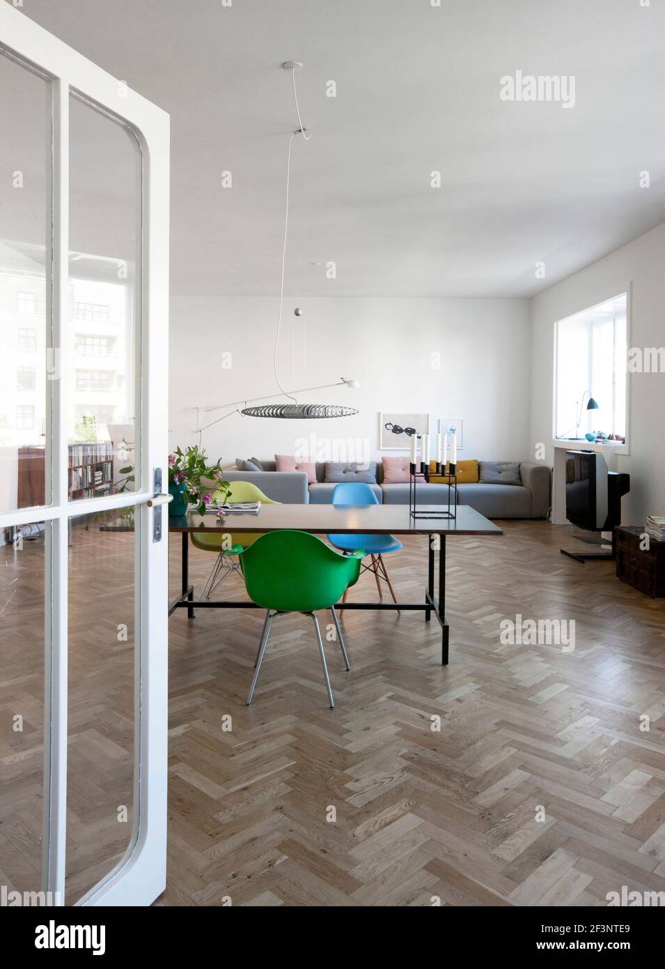 Modernism in the 'Cake House'. A door open on a dining and seating area ...
