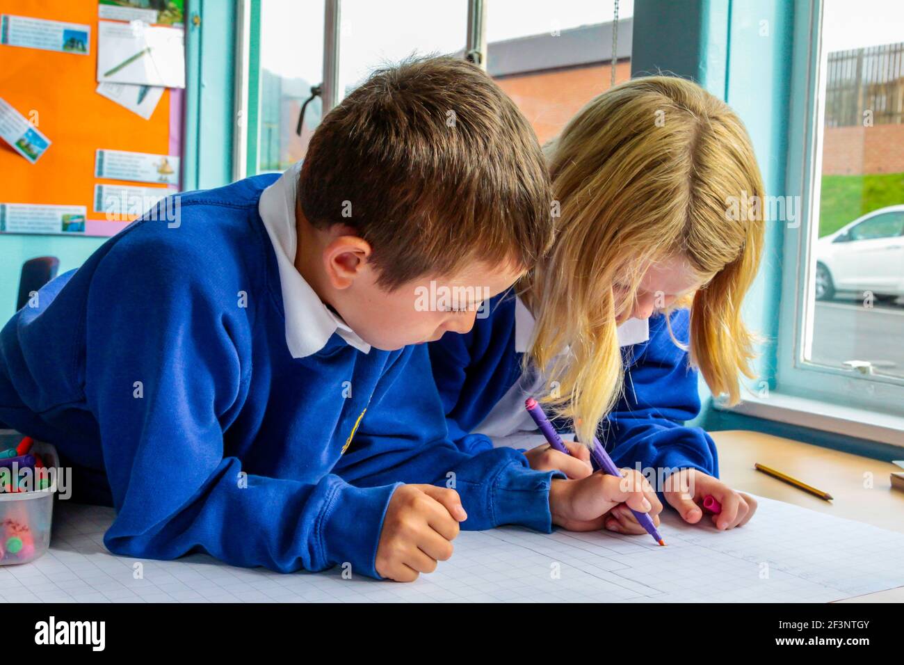 Primary school class writing hi-res stock photography and images - Alamy