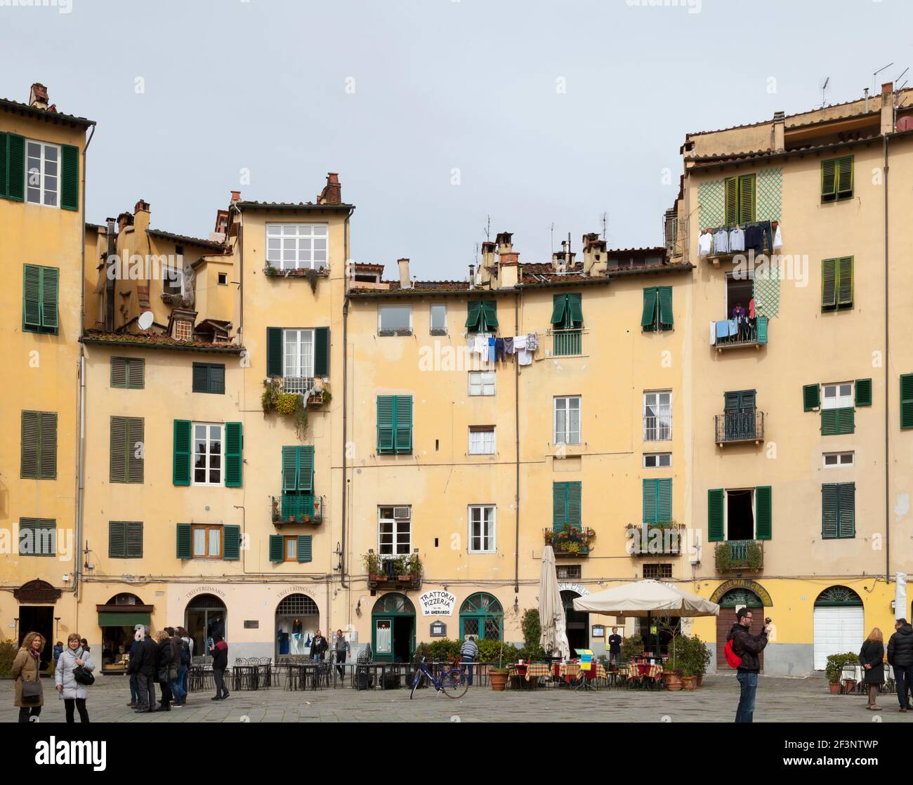 View of the inside of the Piazza dell'Anfiteatro in Lucca, Tuscany. The ...