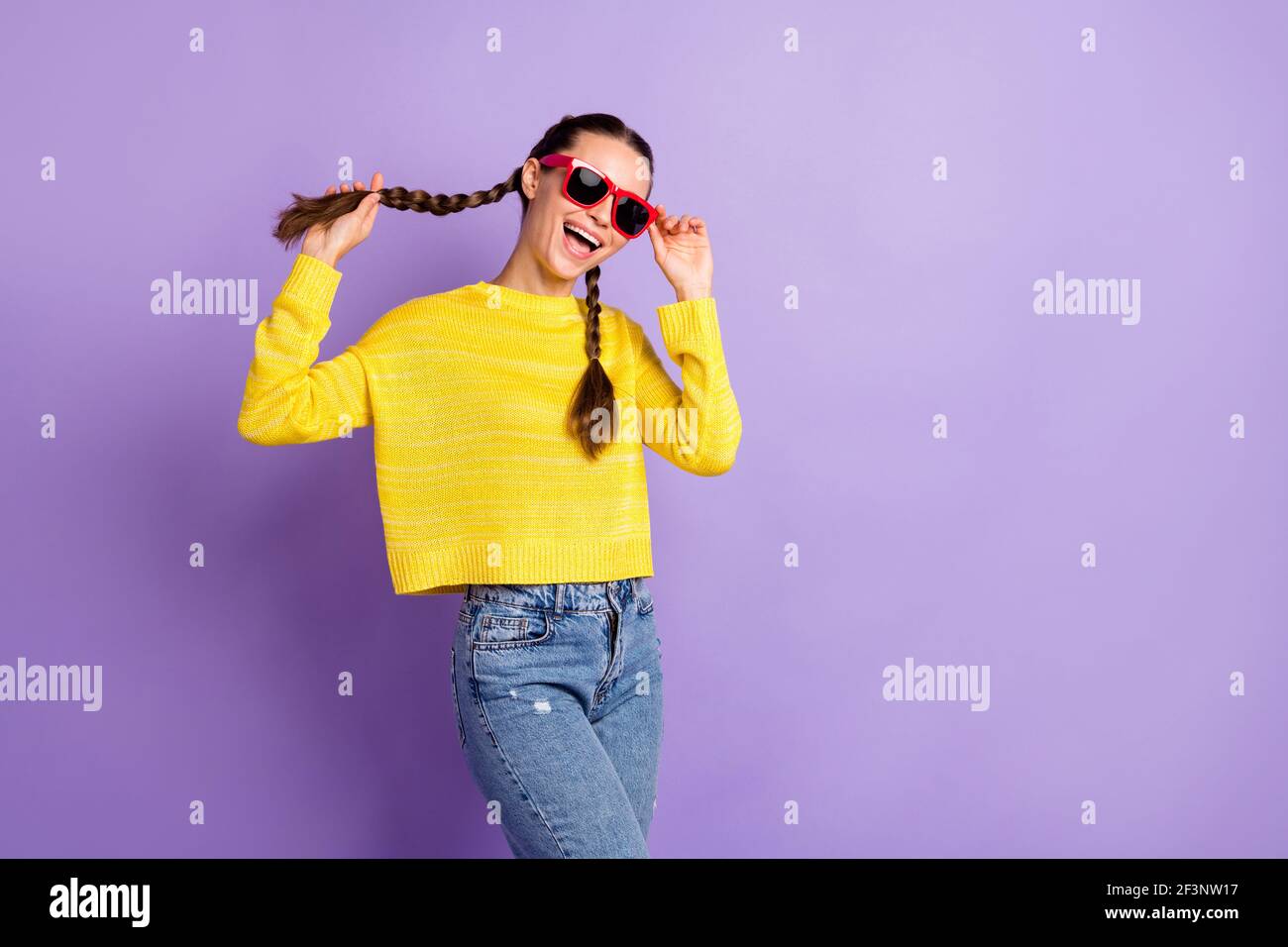 Portrait of adorable young lady hand touch playing with hair tail ...