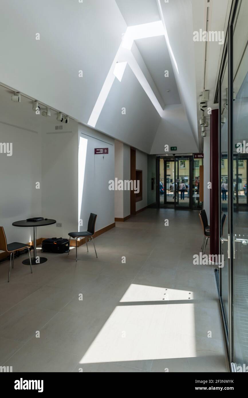Atrium at the Kingston Quaker Centre, with people chatting Stock Photo ...