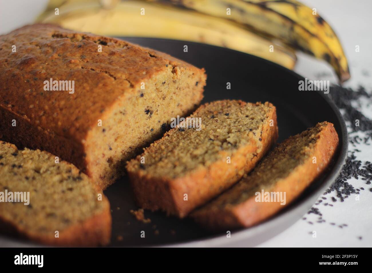 Slices of home baked whole wheat ripe plantain cake. It is also called ...