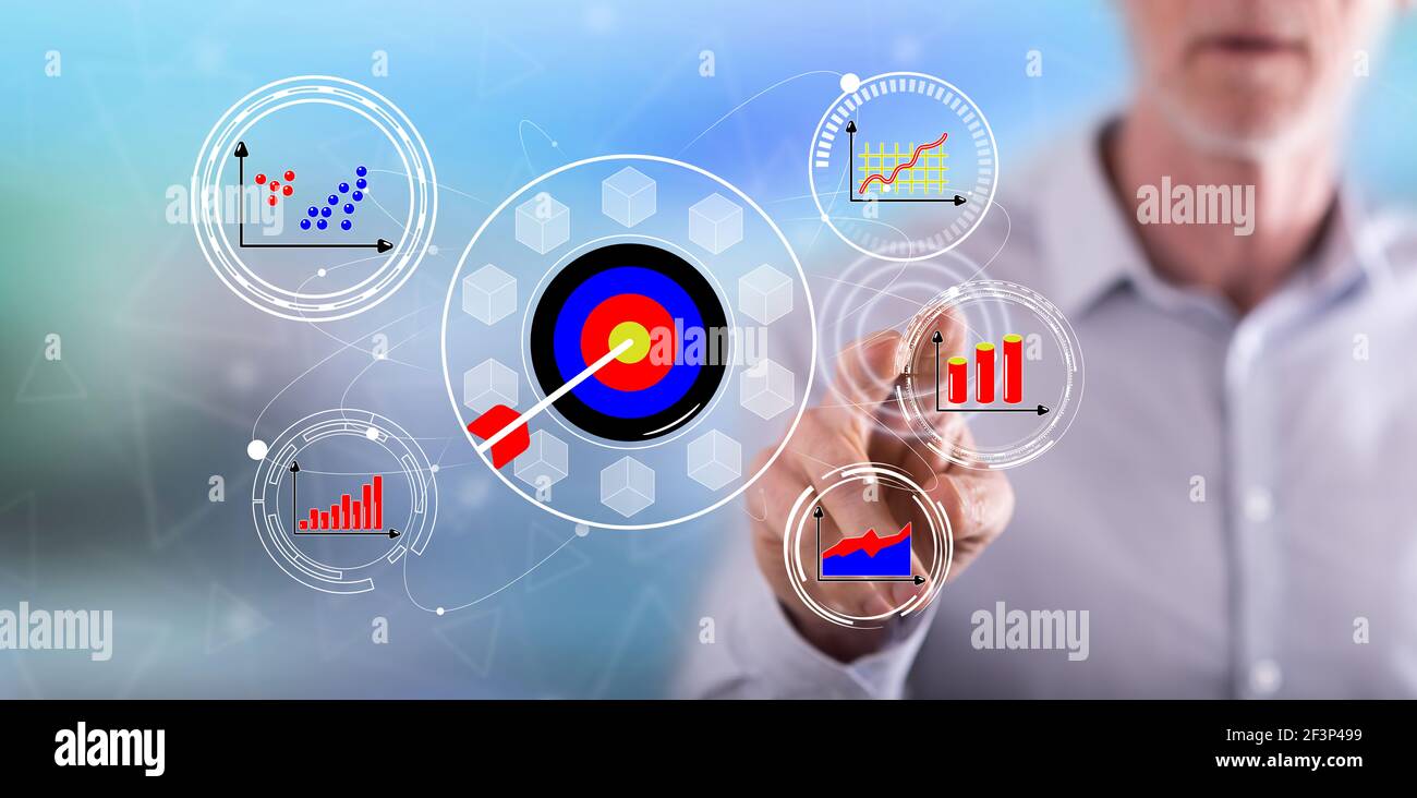Man touching a target marketing concept on a touch screen with his ...