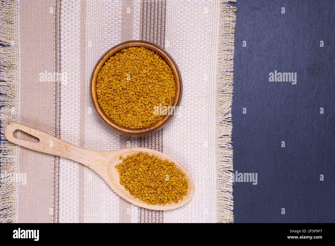 Tea of fenugreek, seeds on a wooden surface. relief from anemia, loss ...