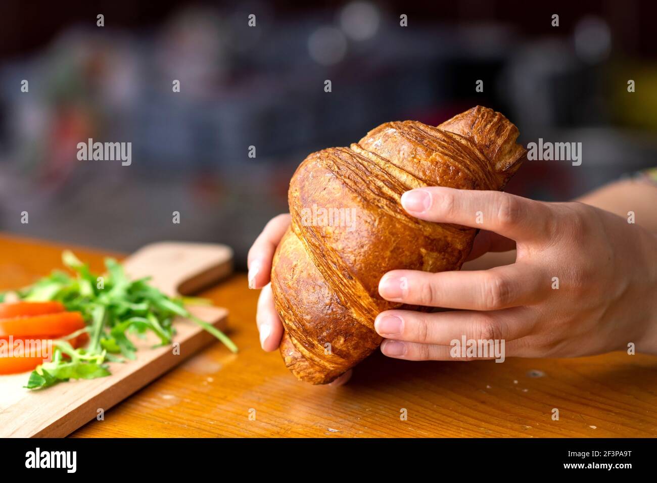 Woman Having Delicious Fresh Croissant For Breakfast Stock Photo - Alamy