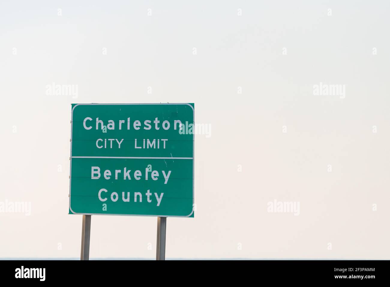 Charleston, USA welcome to city green sign on highway road street with ...