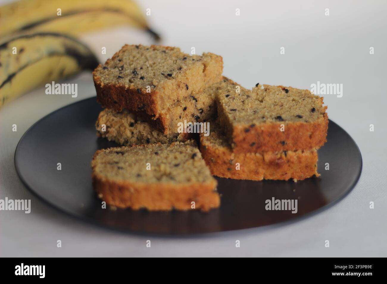 Slices of home-baked whole wheat ripe plantain cake. It is also called ...