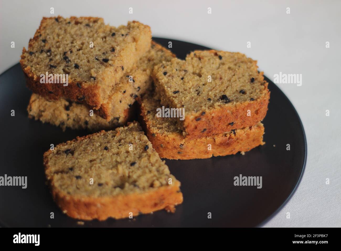 Slices of home baked whole wheat ripe plantain cake. It is also called ...