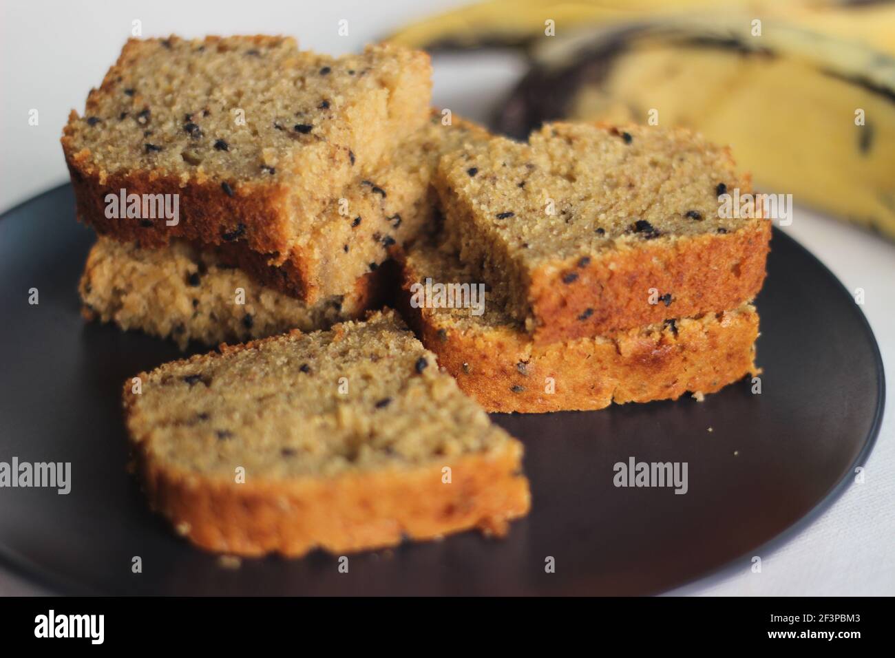 Slices of home baked whole wheat ripe plantain cake. It is also called ...
